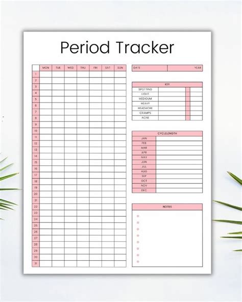 The Printable Period Tracker Is Shown On Top Of A White Table With Palm