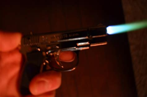 R2 Music Store — Gun Lighter Led Flashlight Combo