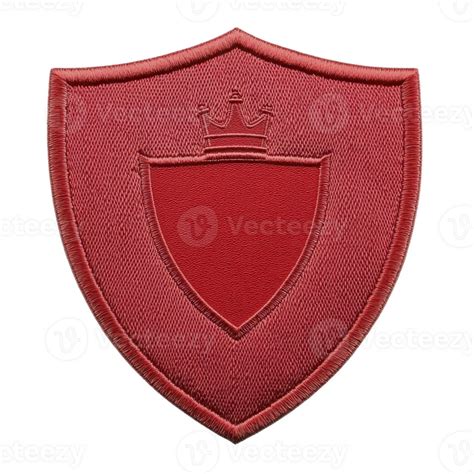 A Red Embroidered Shield Patch With Crown Design Symbolizes Protection