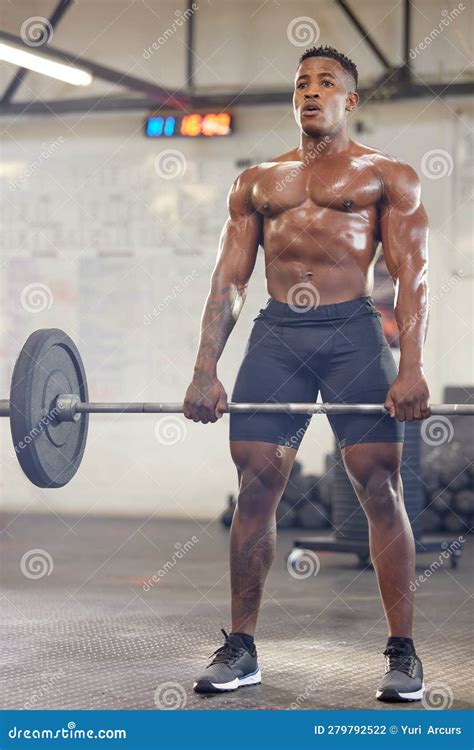 Fitness Muscle And A Black Man Bodybuilder With A Barbell In The Gym