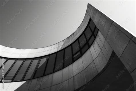 Dynamic Architectural Curves Captured In Monochrome Highlighting The Interplay Of Light And
