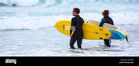 Surfers At Polzeath North Cornwall England United Kingdom Uk Europe