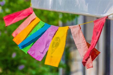 Premium Photo Multi Colored Flags Hanging On String