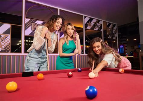 Young Adults Playing Pool At Hollywood Bowl Birmingham Resorts World