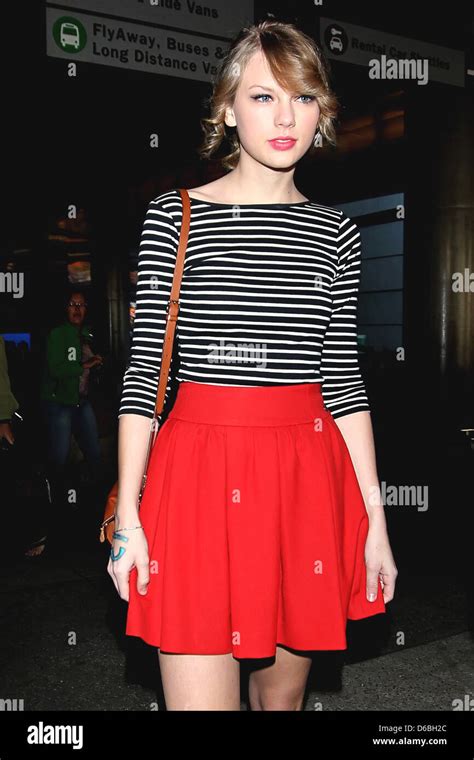 Taylor Swift Wearing A Striped Shirt As She Arrives At Lax Airport Los