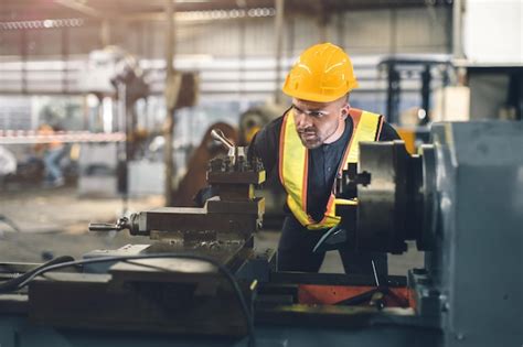 Premium Photo Young Engineer Male Worker Work In Heavy Metal Industry