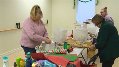Santas For Seniors Assemble Packages To Brighten The Holidays