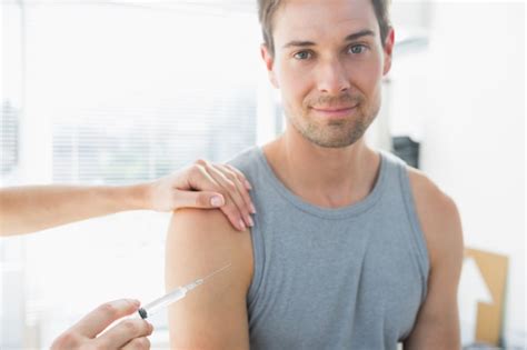 Premium Photo Man Being Injected By Doctor