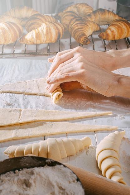 Premium Photo The Chef Cooks Croissants In The Kitchen In The Morning