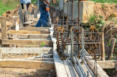 Premium Photo Low Section Of Men Working At Construction Site With