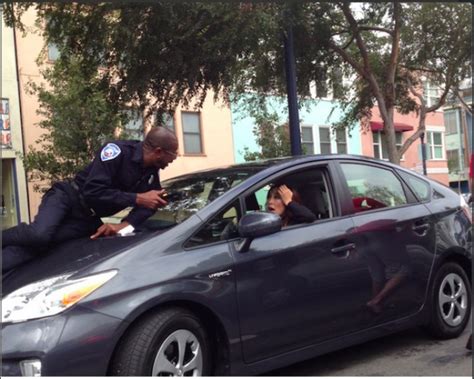 Woman Who Drove Off With Meter Maid On Her Car Says She Was Fleeing