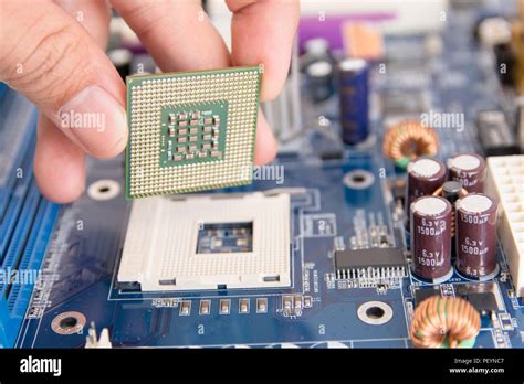 Technician Installing CPU Chip Microprocessor To Socket On Motherboard Stock Photo Alamy