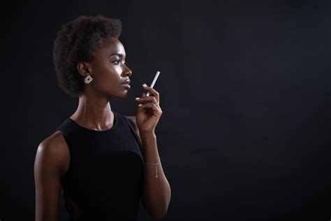 Premium Photo Sexy African American Woman Smoking Cigarette On Black
