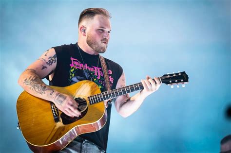 Zach Bryan Publie « This Worlds A Giant Rolling Stone