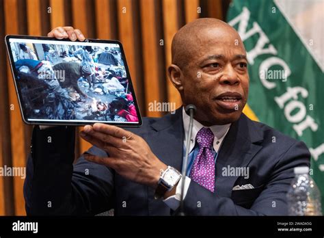 Mayor Eric Adams Holds Photo Of Homeless Camp In San Francisco While