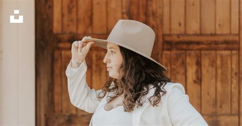 Woman In White Long Sleeve Shirt And Blue Denim Daisy Dukes Wearing