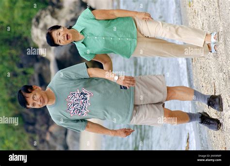 TOKYO Japan The Takeuchis Take A Walk On A Seaside Near Their Home In Puerto Azul The