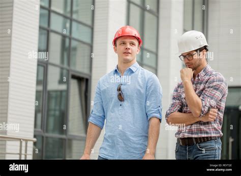 Engineer Is Deliberating A Matter While His Partner Is Waiting The