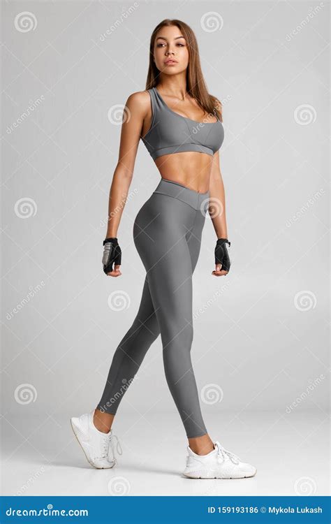 Fitness Woman Beautiful Athletic Girl On The Gray Background Stock