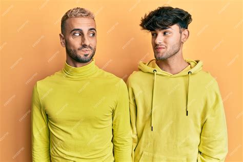 Premium Photo Homosexual Gay Couple Standing Together Wearing Yellow