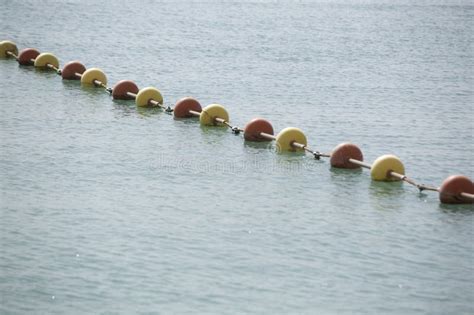 A Line Of Yellow Buoys Stretches Into The Aegean Sea Stock Image