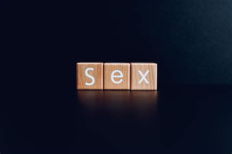 Premium Photo Wooden Blocks Form The Text Sex Against A Black Background
