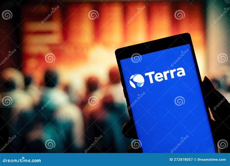 hand holds a smartphone with the logo of the terraform labs on the