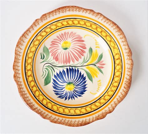HENRIOT QUIMPER Service à café et à dessert en faïence polychrome à décor de fleurs