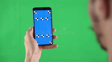 Man Holds The Phone Vertically In Hand And Runs Finger Along The Touch Screen Chromakey To Side