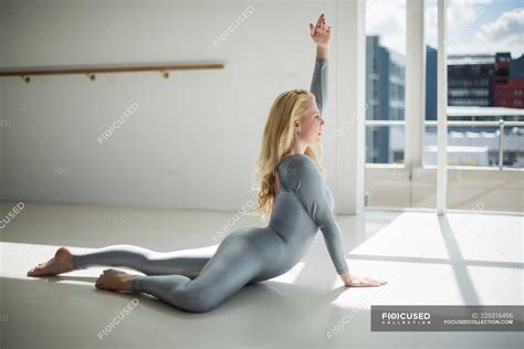 Ballerina Practicing A Ballet Dance In Ballet Studio Female Elegant Stock Photo
