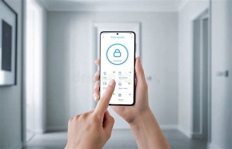 Hand Holding A Smartphone With A Security App Interface Controlling Home Safety Features Like