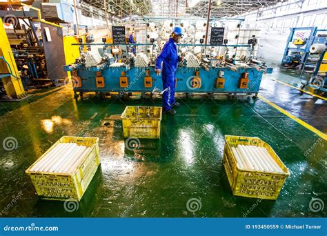 African Factory Worker On A Copwinder Weft Assembly Line Loom Editorial