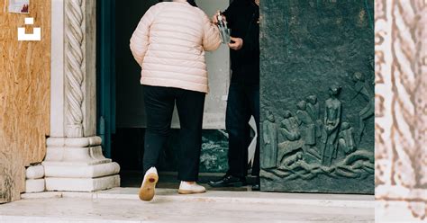 Man In White And Black Striped Long Sleeve Shirt And Black Pants