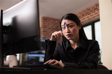 Tired Tech Enginner Brainstorming Ideas About Coding Solution Stock
