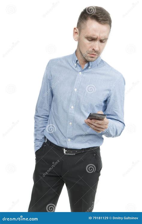 Serious Young Man Talking On Mobile Isolated On White Background Stock