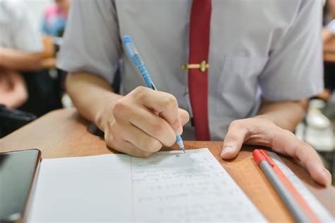 Premium Photo Student Doing Class Assignment Or Taking Written Test