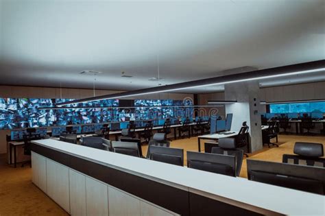 Empty Interior Of Big Modern Security System Control Room Workstation With Multiple Displays
