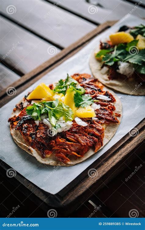 Vertical Shot Of Al Pastor Tacos On Wooden Tray In Mexico Stock Image