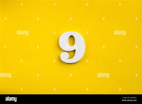 Number 9 White Wooden Number On Yellow Background Stock Photo Alamy