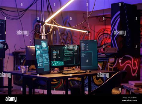 Computers With Malicious Ransomware Running Code On Screens In