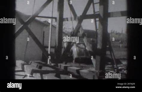 1937 Men Erect Steel Girders And Beams Atop Tower Next To Completed