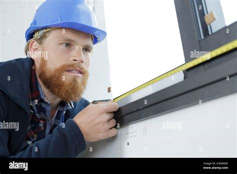 Service Man Measuring Window For Installation Indoors Closeup Stock Photo Alamy