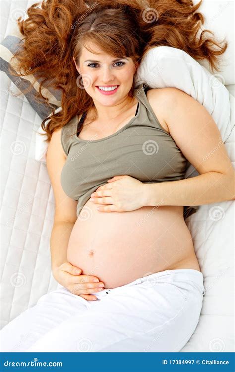Happy Beautiful Pregnant Woman Relaxing on Sofa Stock Image - Image of happiness, belly: 17084997