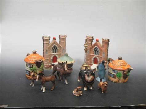 Lot 22 A Pair Of Staffordshire Gateway Spill Holders