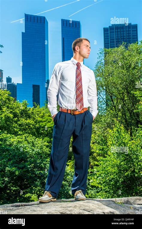 Standing Up Looking Far Wearing A White Long Sleeve Shirt Black