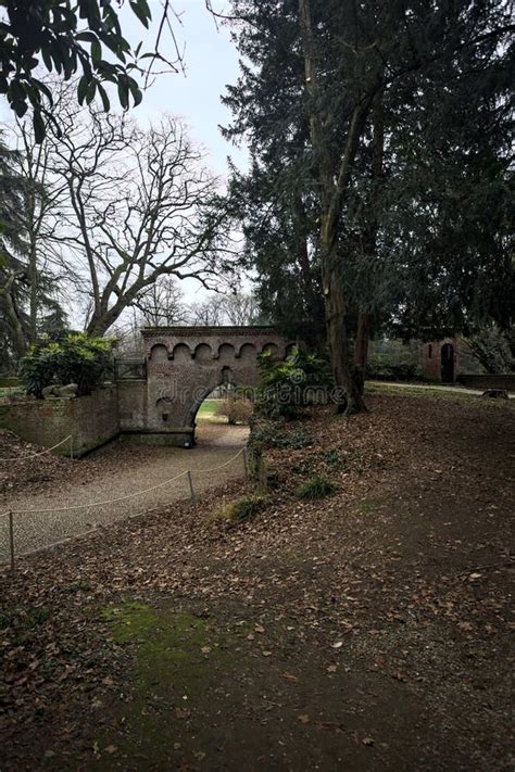 Gravel Path That Passes Under A Brick Bridge In A Park Stock Image
