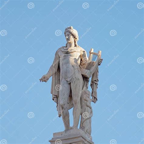 Apollo Statue With His Face Illuminated By Sun Rays On Blue Sky