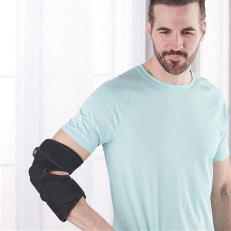 The Heated Vibration Therapy Compression Elbow Wrap Hammacher Schlemmer