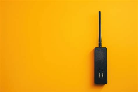 A Black Wireless Router With An Antenna On A Bright Yellow Background Premium Ai Generated Image