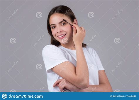 Combs Eyebrows With A Brush In A Beauty Salon Woman With Long